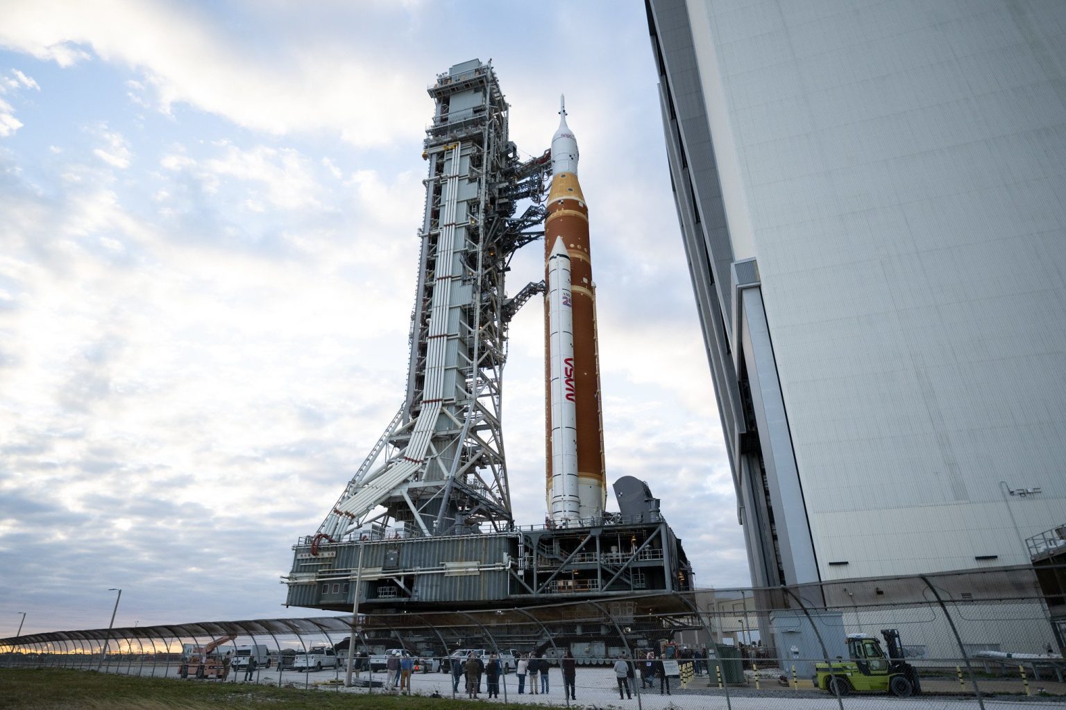 NASA moves new moon rocket to launch pad for first crewed lunar flight ...